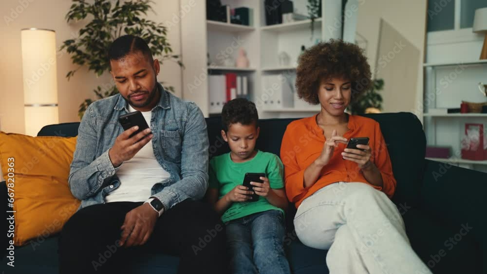 African American family busy on their phones, ignoring real life ...
