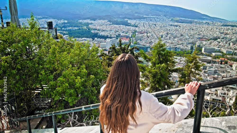 Young woman overlooking Athens from Mount Lycabettus. Beautiful girl ...