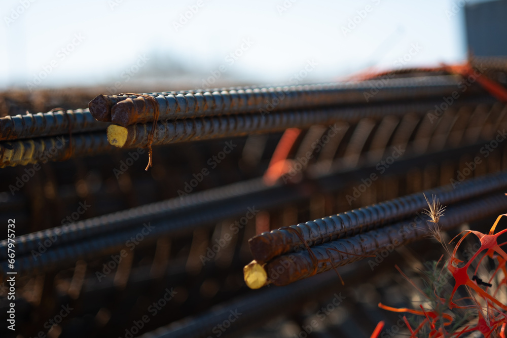 Closeup of a large supply of rebar at a construction site for a major ...