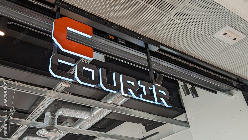 courir c logo brand and text sign front wall shop facade entrance chain ...