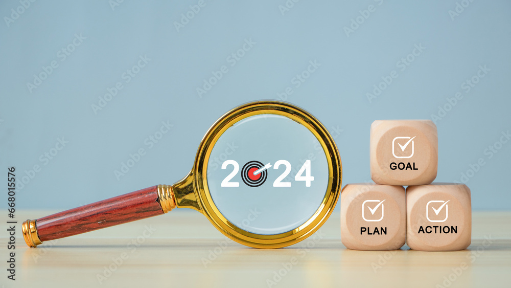 2024 Business target and action plan strategy. Magnifying glass with ...