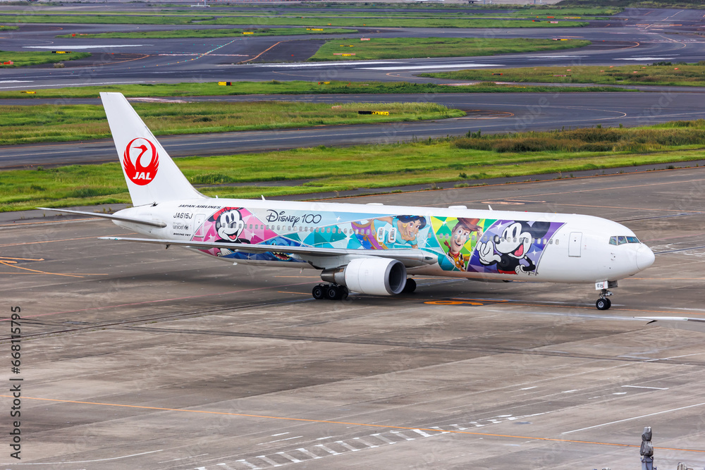 Japan Airlines JAL Boeing 767-300ER airplane at Tokyo Haneda Airport in Japan Disney 100 special ...