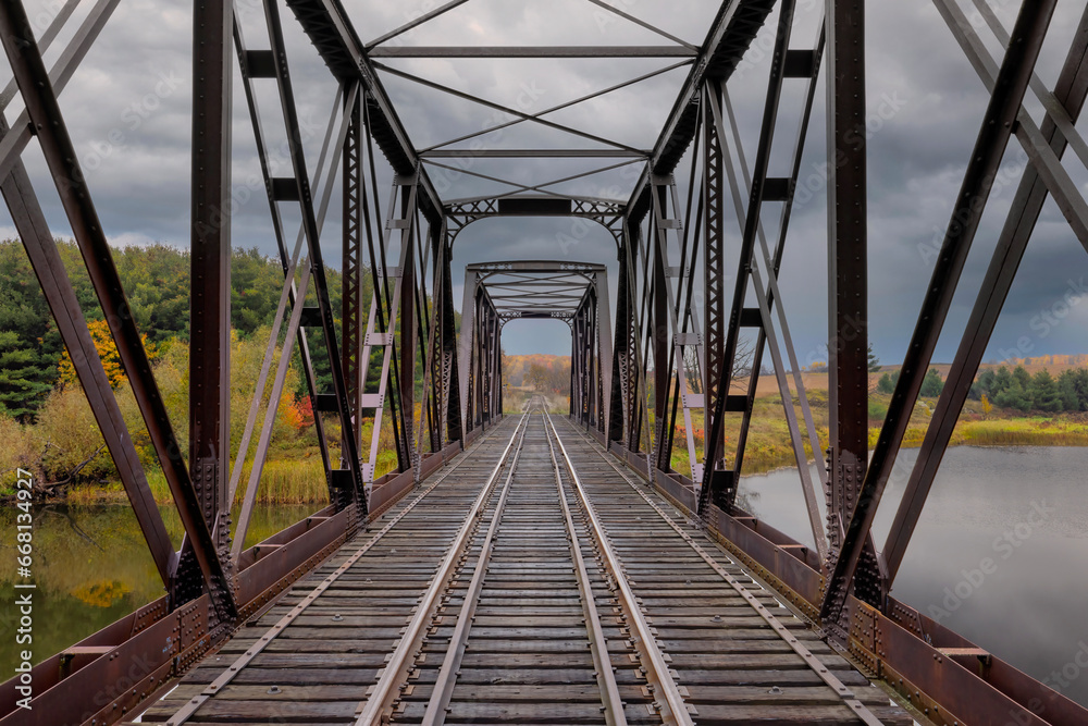Double span riveted railway truss bridge built in 1893 crossing the ...