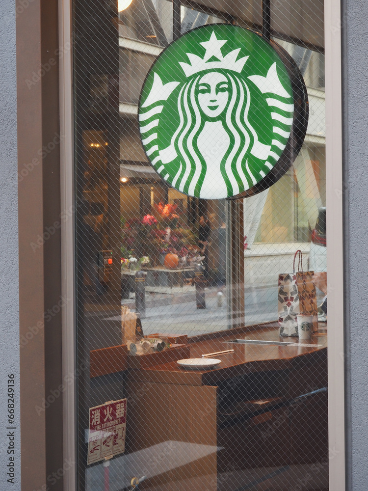 TOKYO, JAPAN - October 26, 2023: Sign in the window of a Starbucks ...