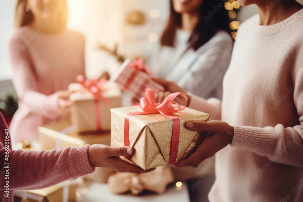 Close up of a Young man giving a gift box with pink bow to his ...