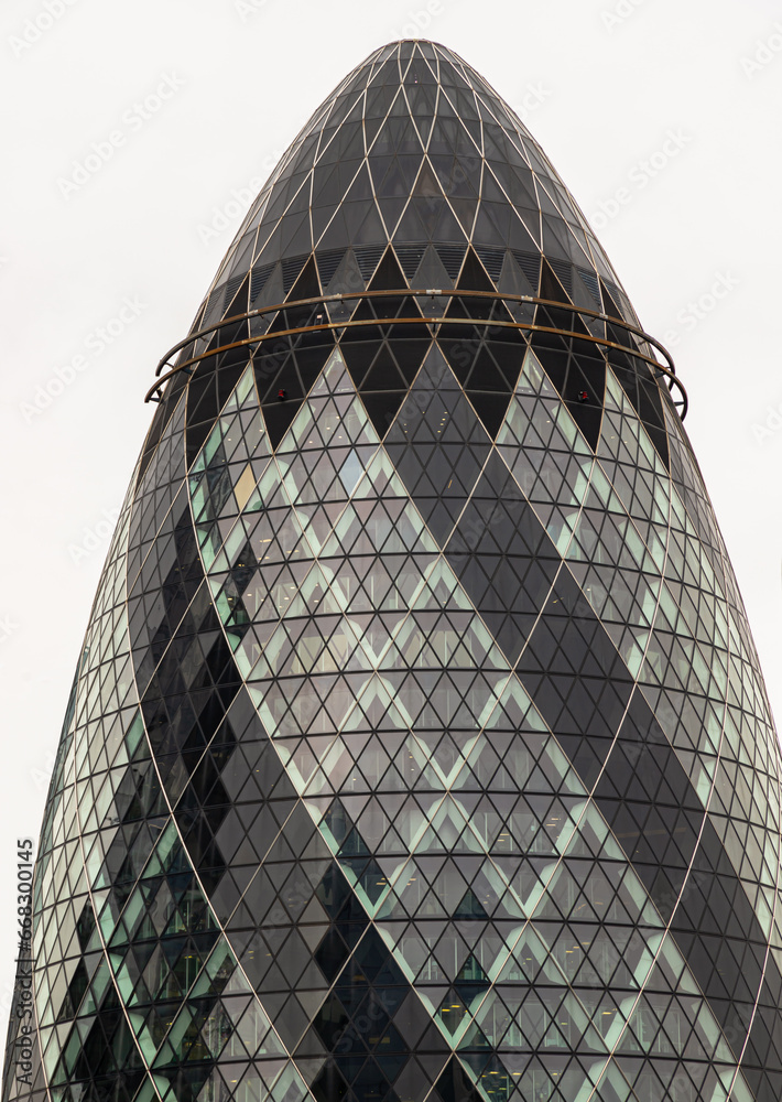 London, UK - Oct 23, 2023 - The tip of Gherkin building (The swiss re ...