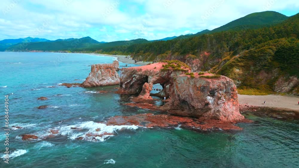 Video „Top view of beautiful coast with rocky arches. Clip. Amazing ...