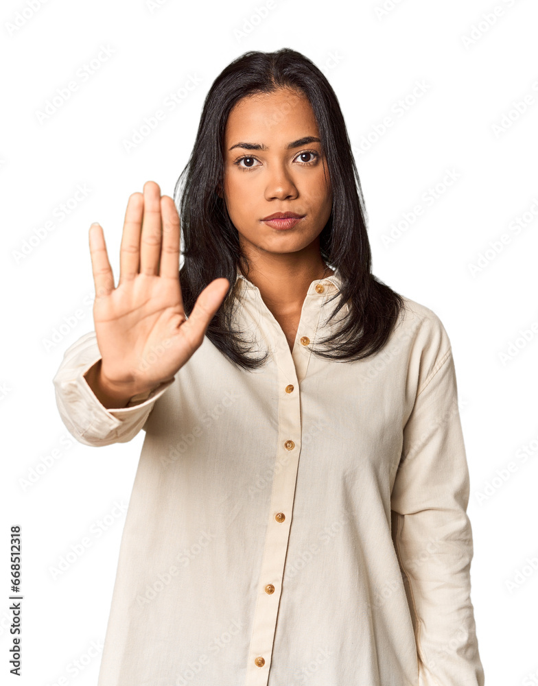 Young Filipina with long black hair in studio standing with ...