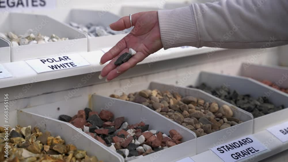 Women wearing a ring sampling different types of rock and gravel at ...