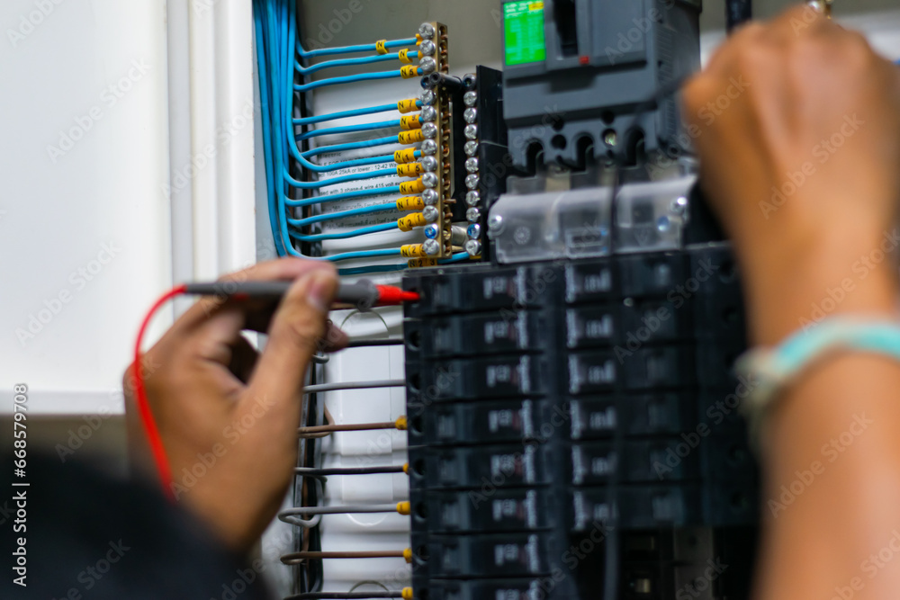 Electrician work tester measuring voltage and current of power electric ...