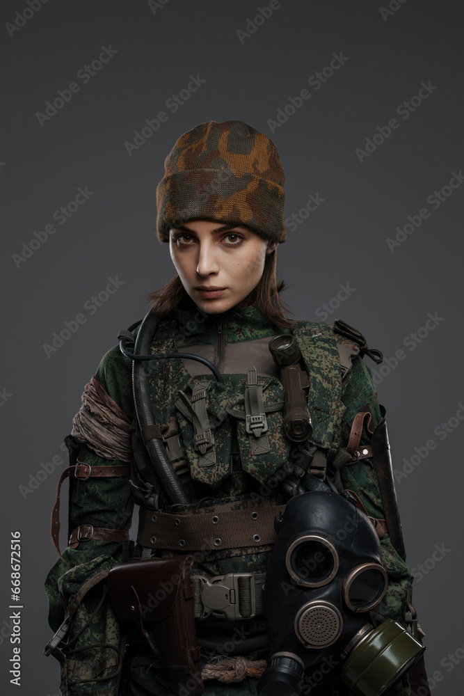Brave woman soldier with wounded hand in military uniform, symbolizing ...