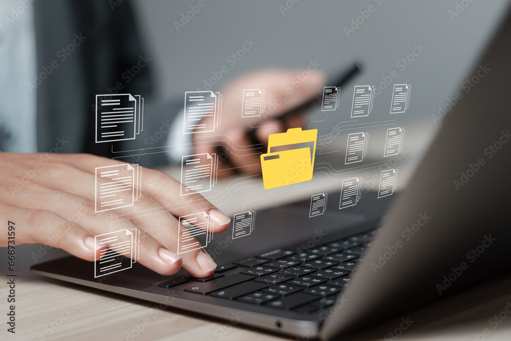 Document management system technology, businessman using laptop with ...