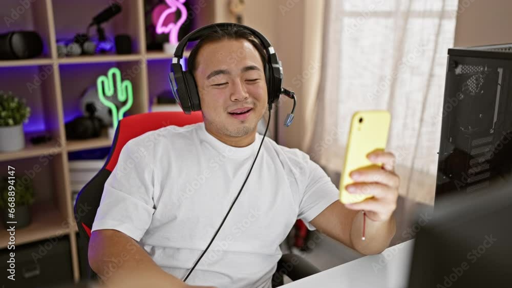 Smiling young chinese streamer man taking entertainment to the next ...