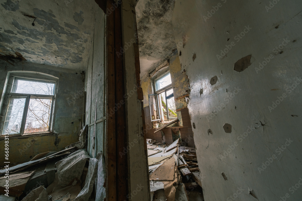 From above interior of shabby abandoned room with peeling painted walls ...