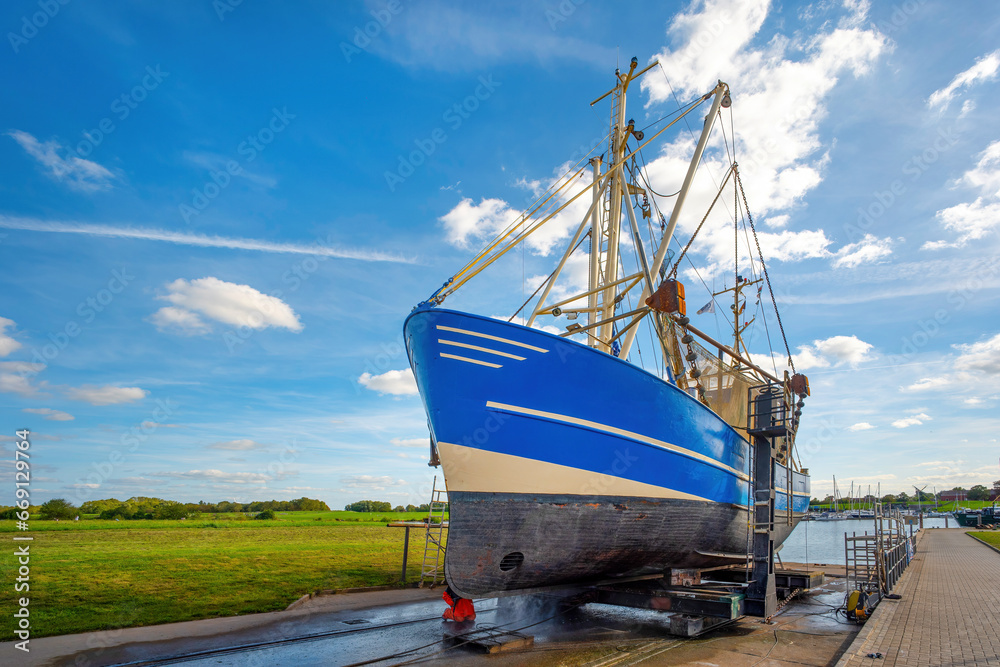 cleaning a ship in the dry dock, cleaning the hull with a high-pressure ...