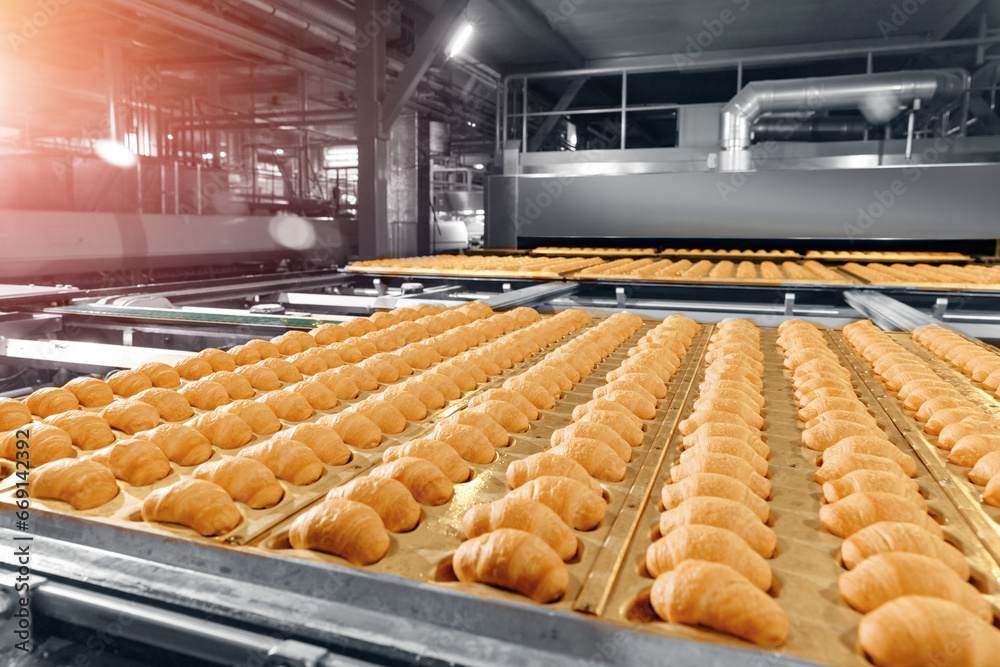 Process Production of French croissants, puff pastry dough pieces are ...