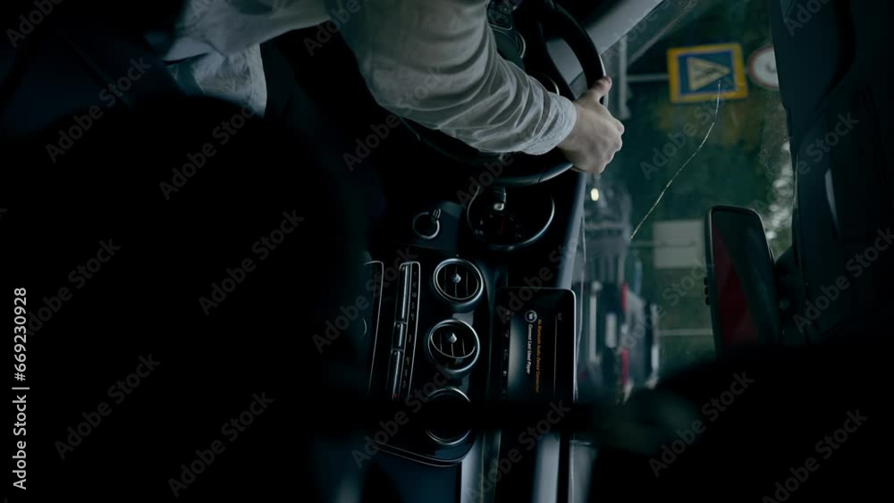 vertical video back view a man a businessman is driving a luxury car ...