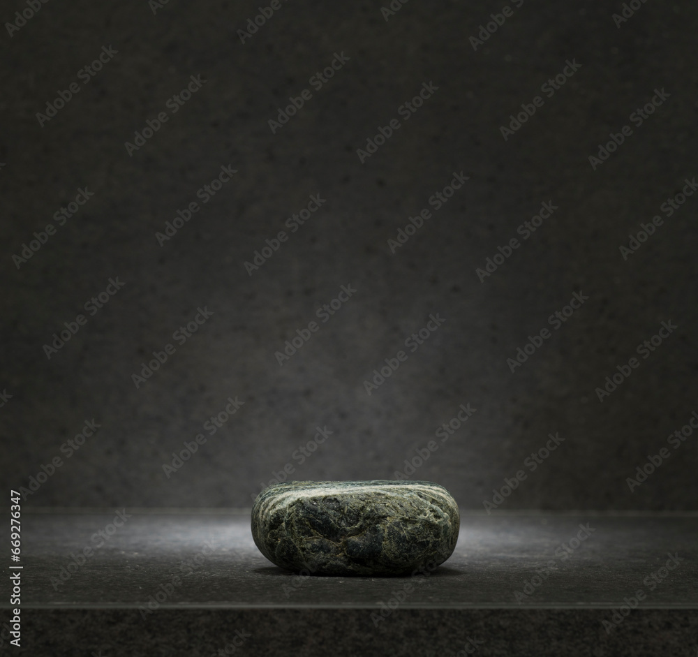 stones on a dark gray background for the podium. stones with texture ...