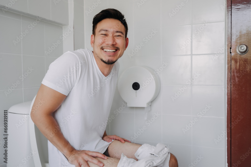 Funny happy face of asian man able to poop after suffer from ...