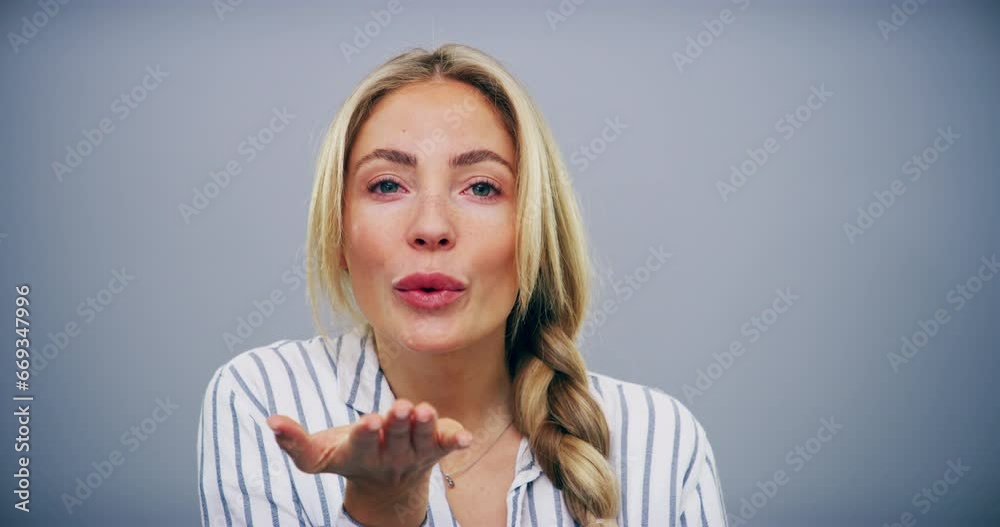 Woman, blow kiss and hand in studio with face, love symbol and pout ...