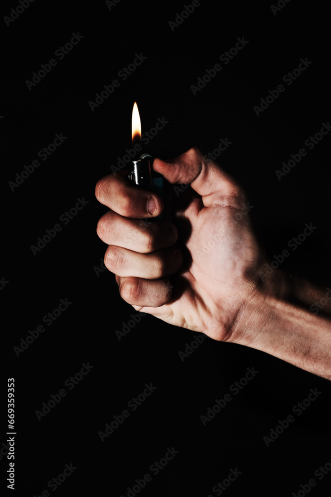 Hand, lighter and fire on black background, heat or warm element ...