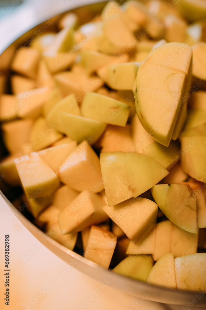 Cubes of apples in a plate. Lots of apples for jam, charlotte or ...