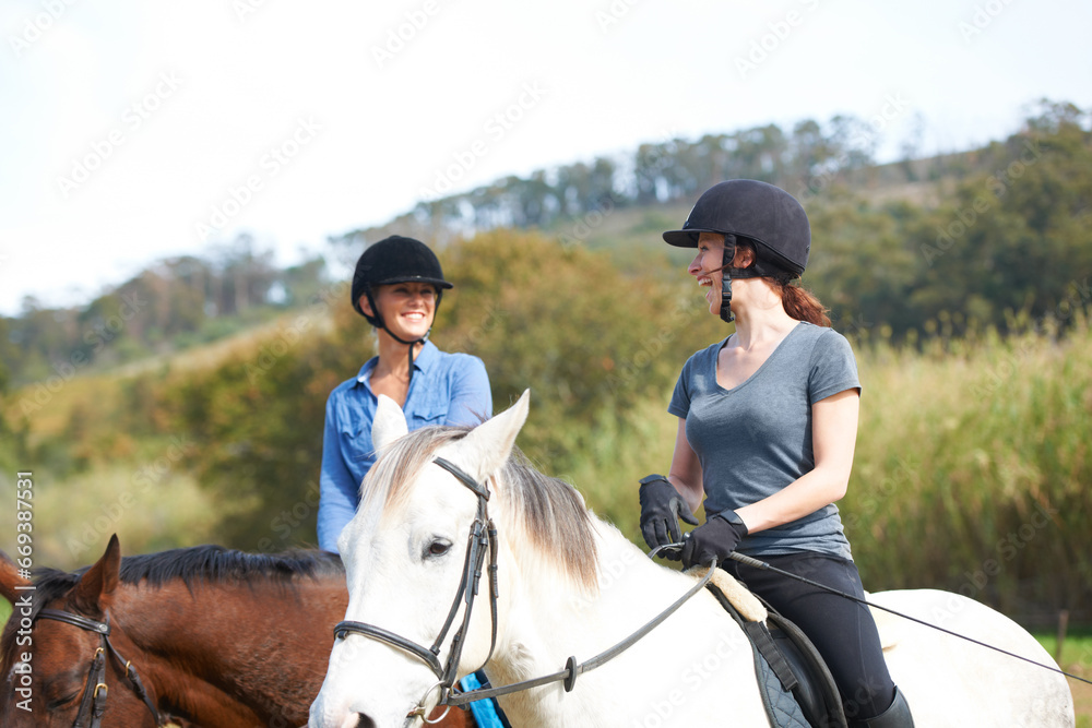Women friends, horse riding and talk with smile in helmet, ranger team ...