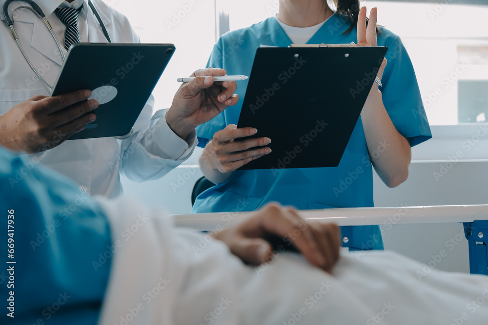 Injured patient showing doctor broken wrist and arm with bandage in ...