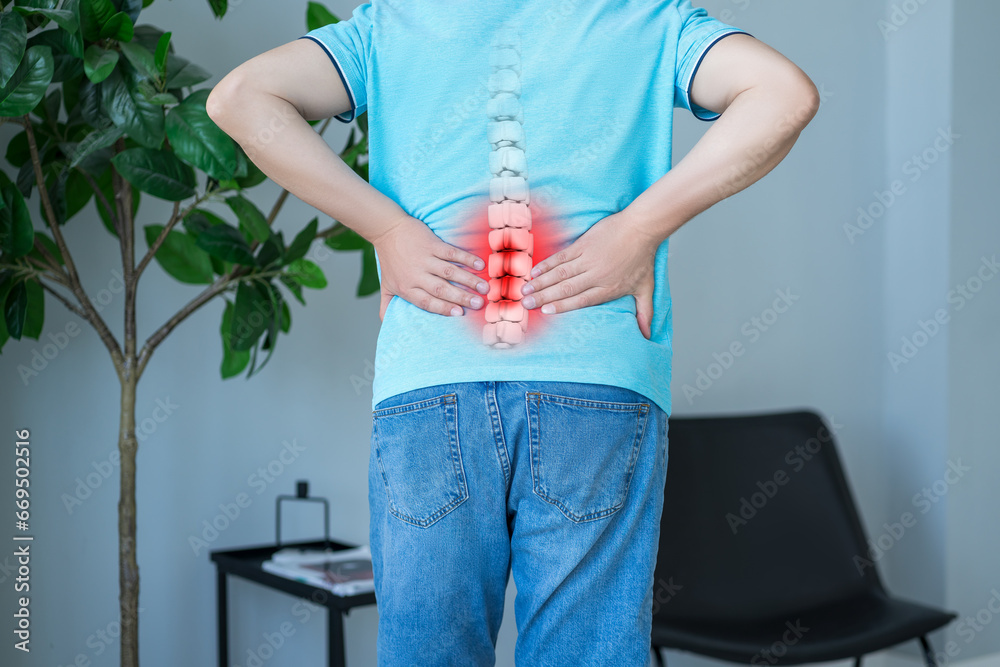 Lumbar intervertebral spine hernia, man with back pain at home, spinal ...