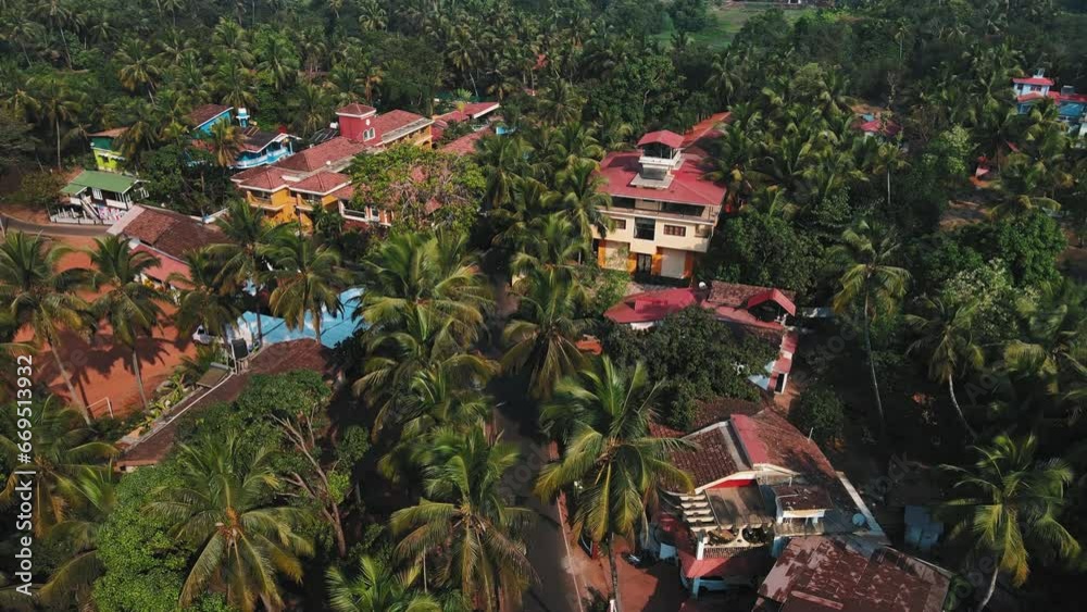 Aerial view of Goa city surrounded by coconut trees. Eagle eye view of ...