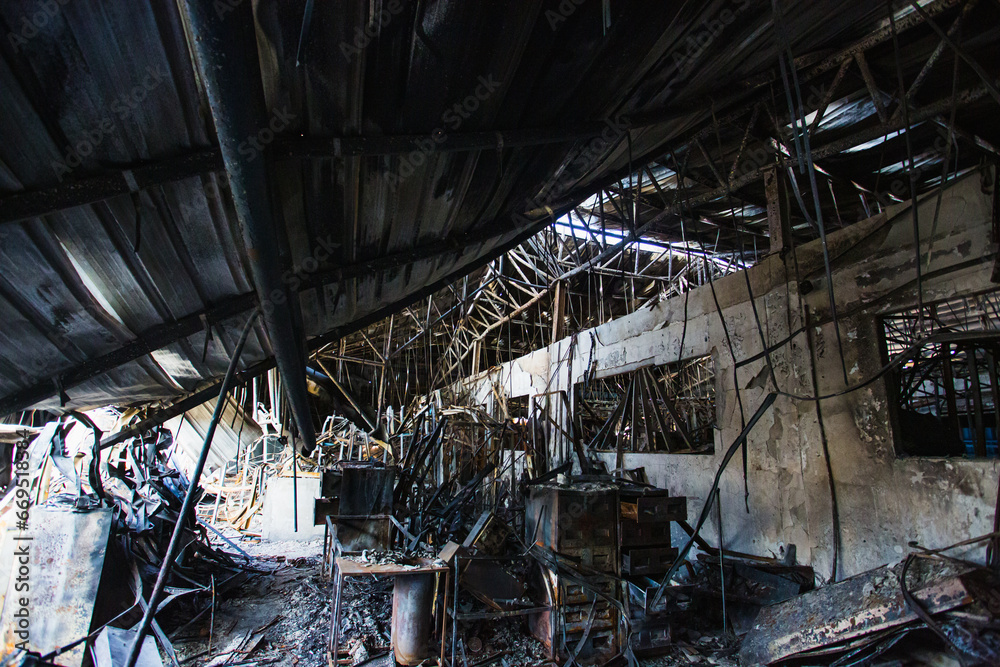 Burnt interiors of ruined factory building after fire, Misfortune in ...