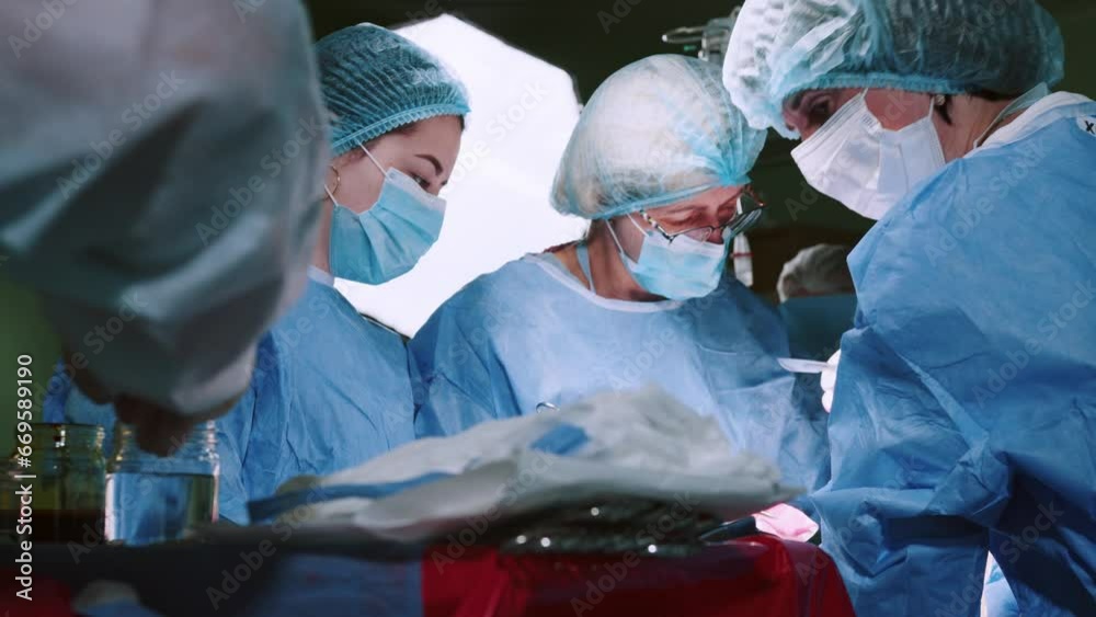 Doctor Performing Surgery Using Sterilized Equipment. Surgical Team ...