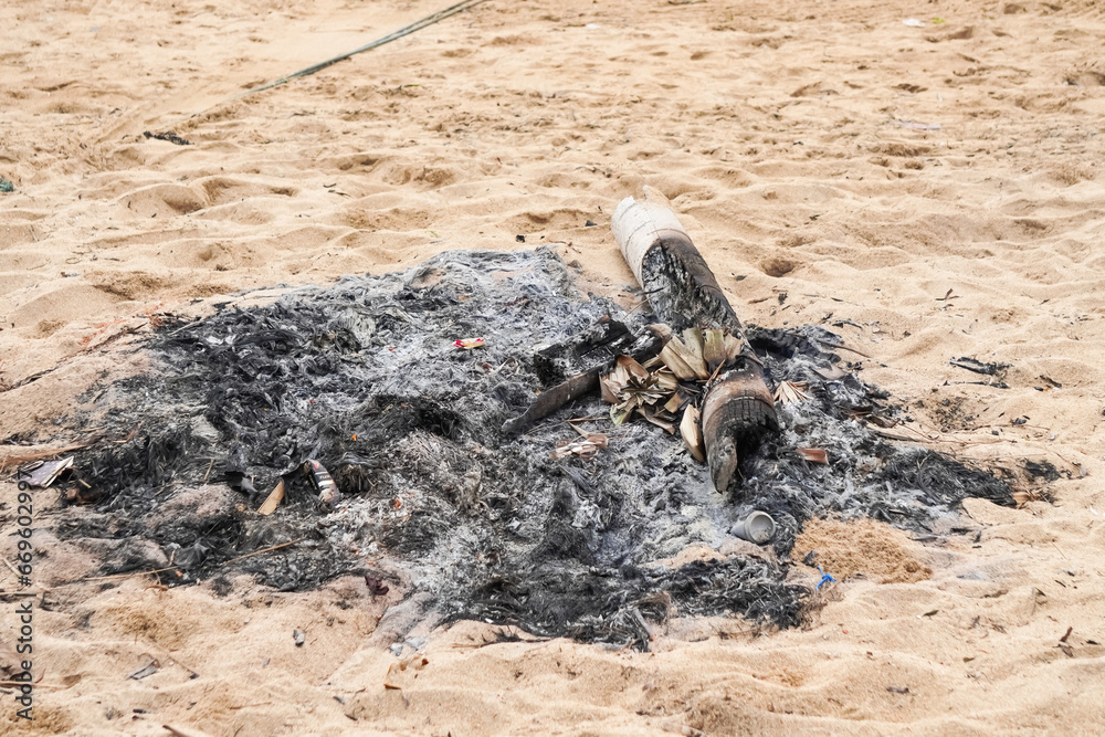 People burns waste on the beach and makes a lot of smoke which can ...