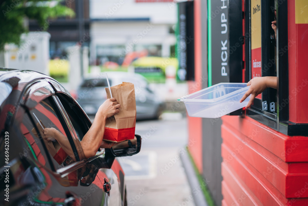 Young Man receiving coffee at drive thru counter., Drive thru and take ...