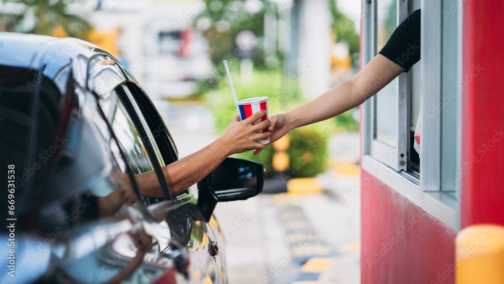 Young Man receiving coffee at drive thru counter., Drive thru and take ...