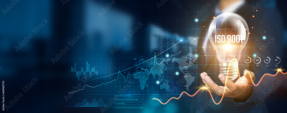 Businessman holding creative light bulb with growth graph and ISO 9001 ...