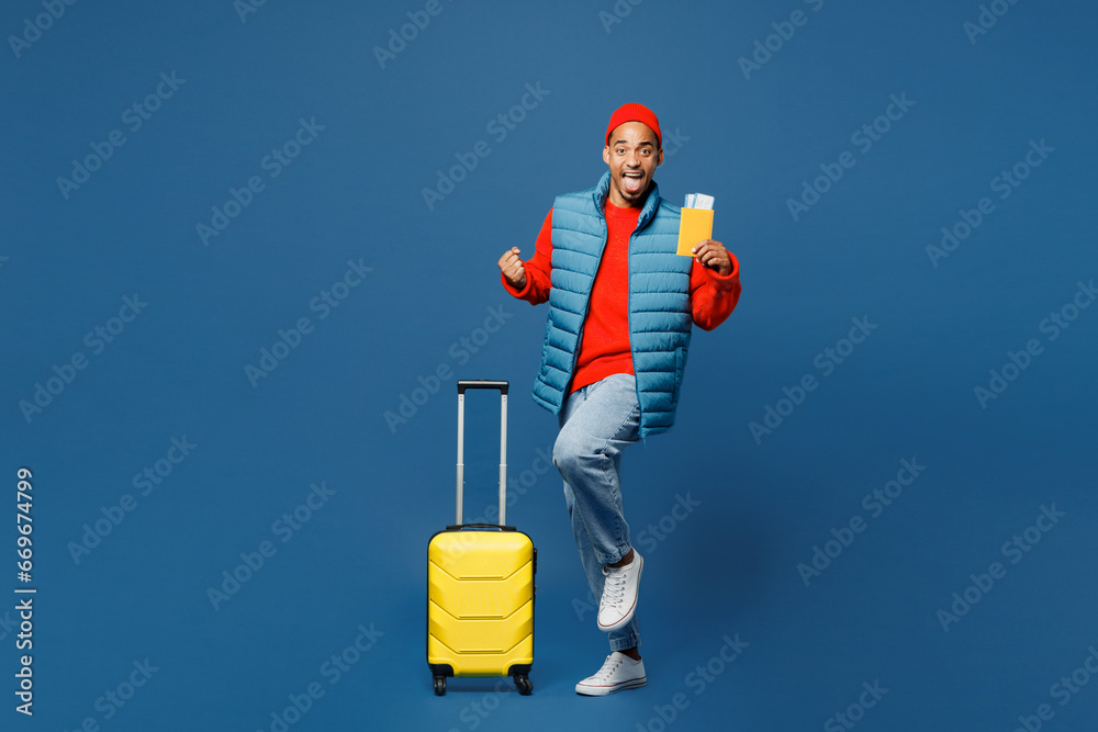 Traveler man wears padded vest hold bag passport ticket isolated on ...