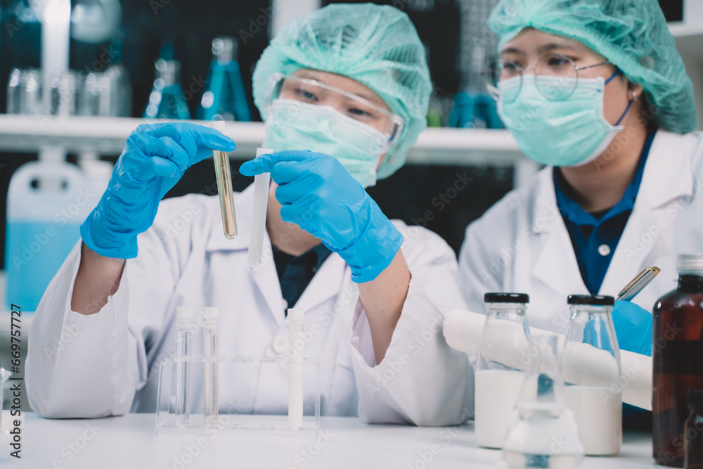 Food scientist testing milk samples of dairy products in the laboratory ...