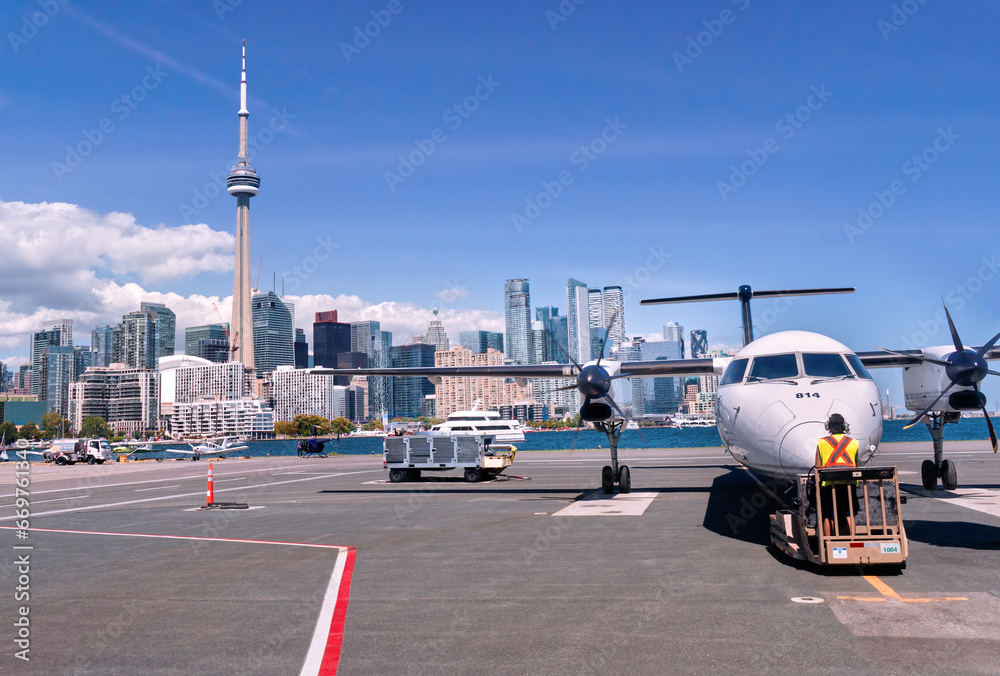 Modern white turboprop airliner with black six-bladed propellers ...