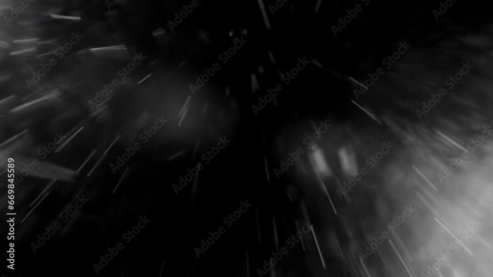 Heavy angled rain falling in front of the camera against black screen ...