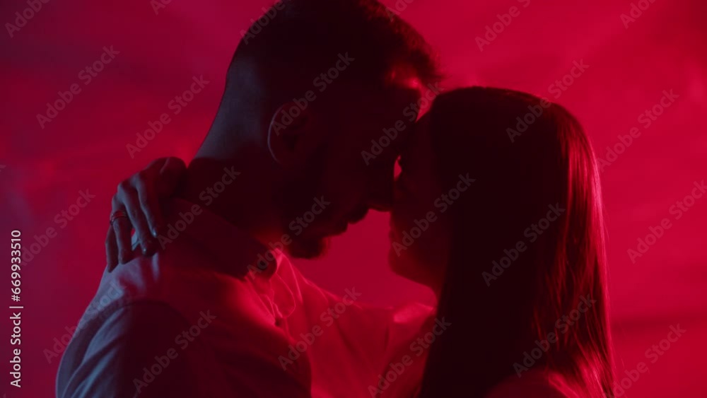 Two Lovers Kissing On Neon Light Background Woman Touching Face Her