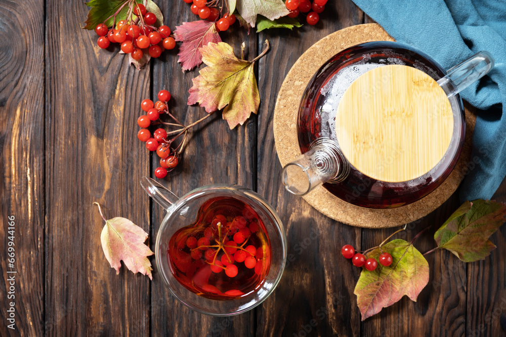 Autumn tea, berry vitamin seasonal drink. Viburnum and cup of healthy ...