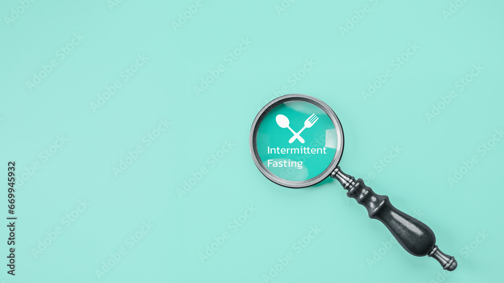 Magnifying glass with spoon and fork icon on light blue background ...