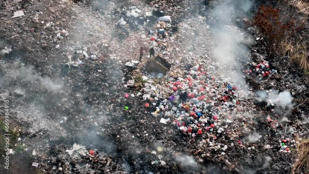 Garbage and fire burn in landfill. Also call trash, waste, rubbish ...