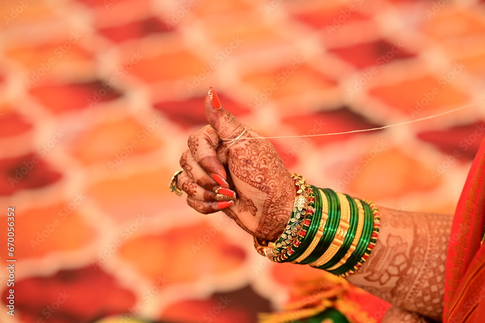Finger of indian bride. white thread around finger. Kanyadaan ceremony ...
