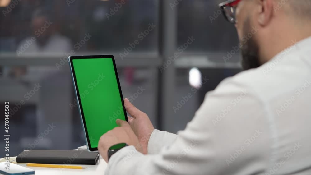 Bearded Man in Glasses Using Tablet Computer with Green Screen Mock Up ...