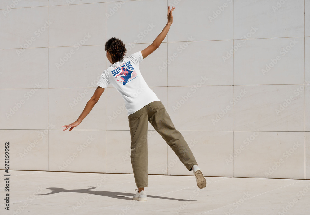 Mockup of woman wearing customizable t-shirt on one leg, arms out Stock ...