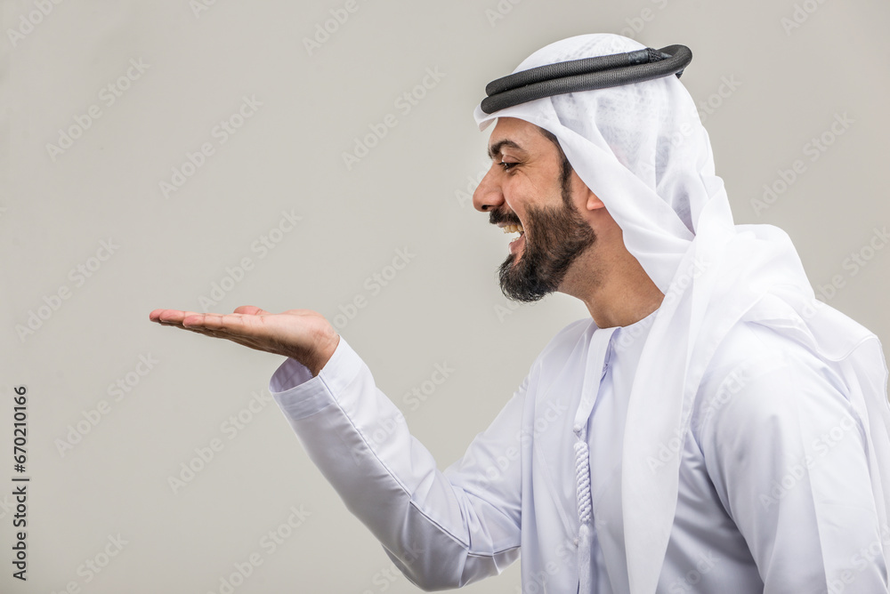 Arabian man wearing traditional emirati dishdasha kandura in studio ...