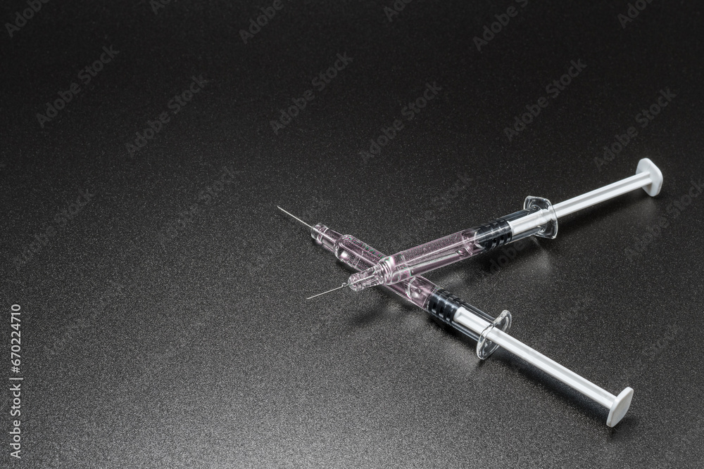 Medical syringes and needles on black background. Medical concept ...