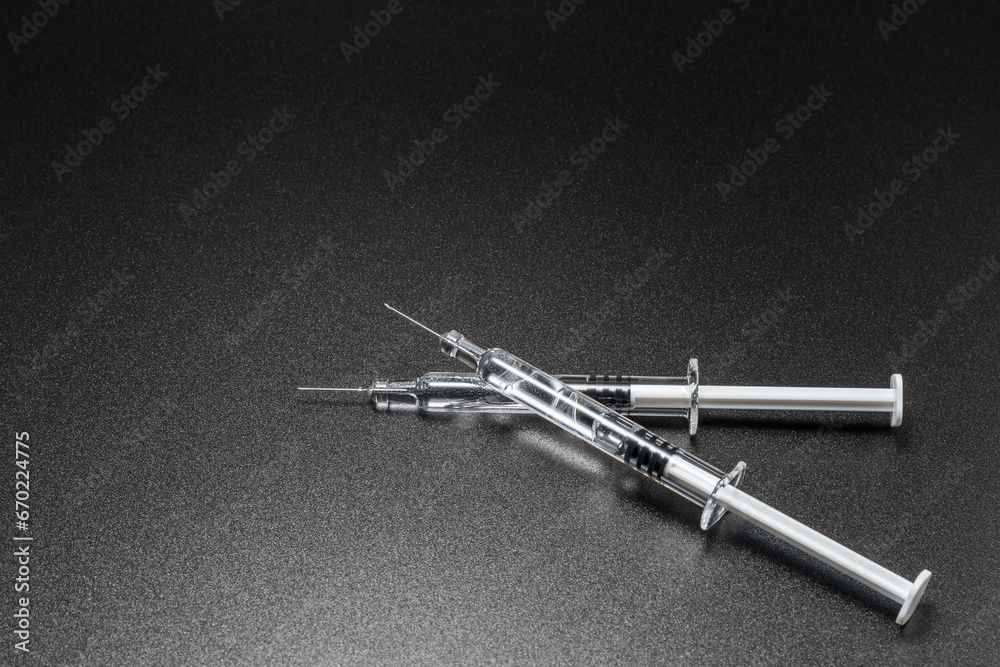 Medical syringes and needles on black background. Medical concept ...